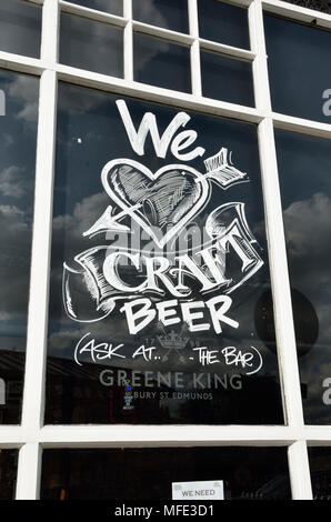 Beer advertisement on the window of a pub on Portobello Road, London ...