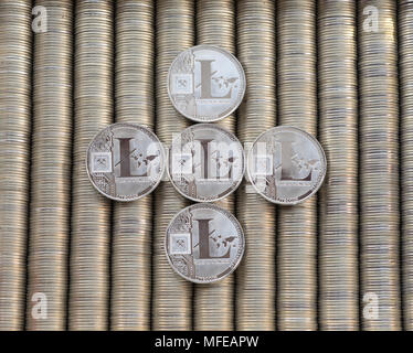 litecoin close up on top of euro paper monete virtual currency concept ...