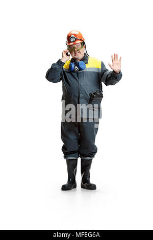 Studio shot of disgusted senior bearded man looking and pointing to the ...