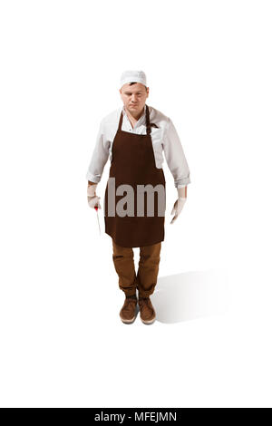 Serious butcher posing with a cleaver isolated on white background ...