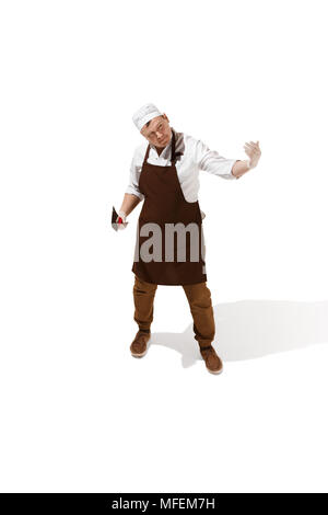 Angry aggressive butcher posing with a cleaver isolated on white ...