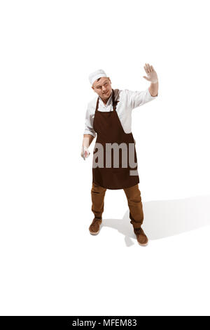 Angry aggressive butcher posing with a cleaver isolated on white ...