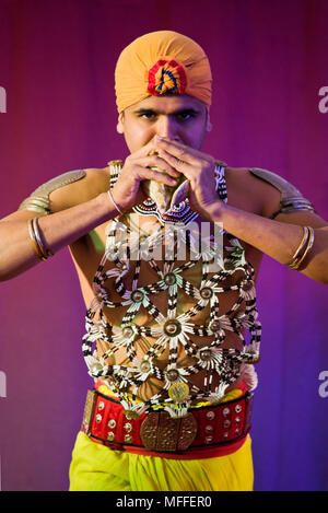 Vertical portrait of a Kandyan Dancer playing a conch shell in Kandy ...