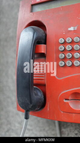 Red payphone on the wall Stock Photo - Alamy