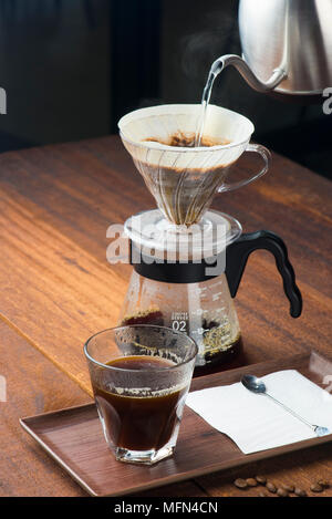 coffee drip process on wood background Stock Photo - Alamy