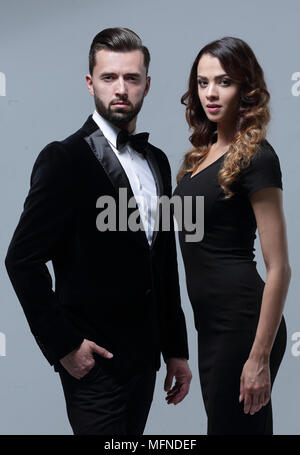 Business partners standing on a gray background Stock Photo - Alamy