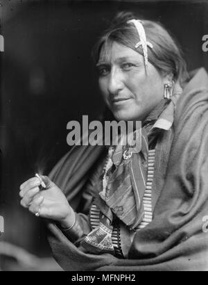 Native North American Indian smoking cigarette. Photograph by Edward ...