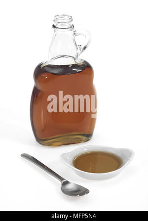 Bottle of Maple Syrup against White Background Stock Photo - Alamy