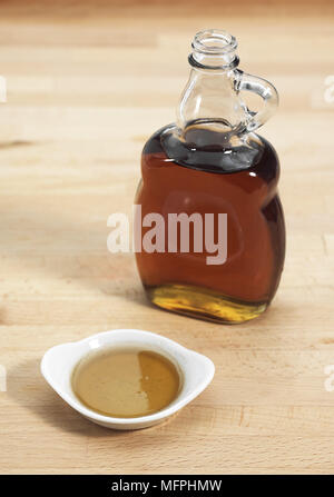 Bottle of Maple Syrup against White Background Stock Photo - Alamy