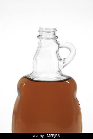 Bottle of Maple Syrup against White Background Stock Photo - Alamy