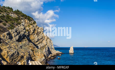 Huge rock and a small rock over the sea Stock Photo - Alamy