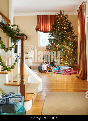 Decorated Christmas Tree in Corner of Room Stock Photo - Alamy
