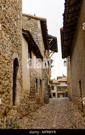 Narrow street in Perouges, France, a medieval walled town, a popular ...