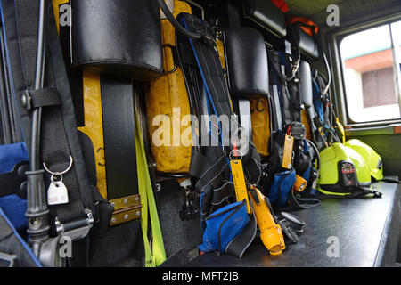 Inside the back seat of a fire engine with helmets and breathing ...