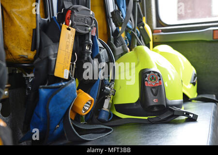 Inside the back seat of a fire engine with helmets and breathing ...