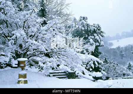 Crowe Hall, snow covered garden and statue Stock Photo - Alamy