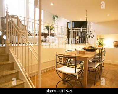 Modern split level dining room with steps up to kitchen area Stock ...
