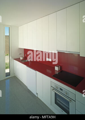 Hob and oven in fitted corner unit in modern kitchen Stock Photo - Alamy