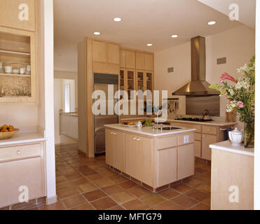 Modern kitchen with central island unit in UK home Stock Photo - Alamy