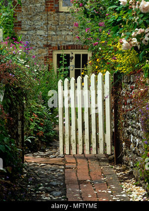 Picket gate entrance to english country cottage Stock Photo - Alamy