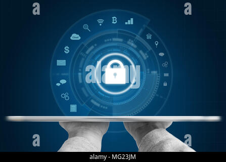 Hand holding tablet with online security and data protection concept ...
