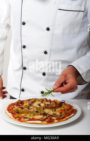 chef decorating a pizza with spices Stock Photo - Alamy