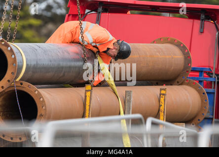 A construction worker laying drainage pipes Stock Photo - Alamy