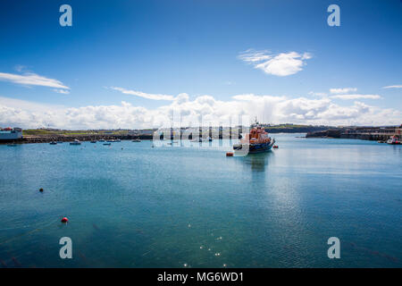 RNLI Lifeboat in Portrush Harbour. In background, Portrush Yacht Club ...