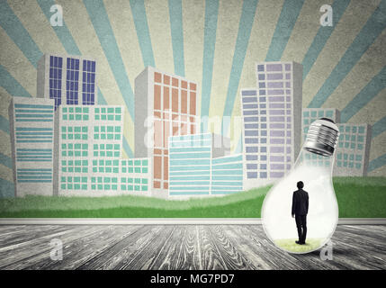 Businessman trapped in bulb Stock Photo - Alamy