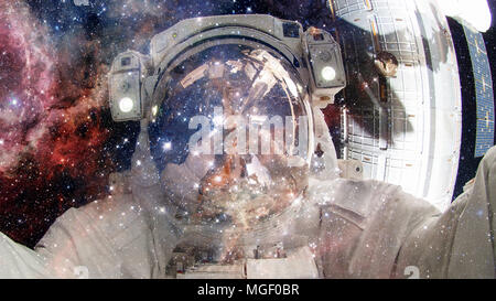 Astronaut in outer space. Nebula on the background Stock Photo - Alamy