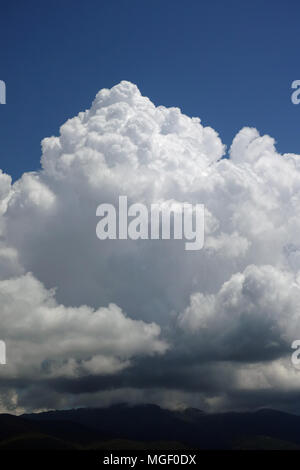 Cumulonimbus a dense, towering vertical cloud typically forming from ...