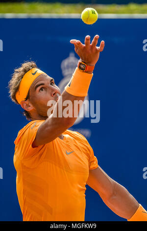 Rafael Nadal of Spain serves against Novak Djokovic of Serbia during ...