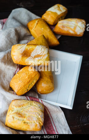 Freshbaked homemade french bread on rustic background Stock Photo - Alamy