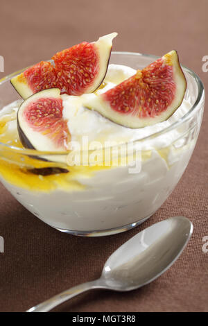 Fresh Greek yoghurt with figs and honey Stock Photo - Alamy