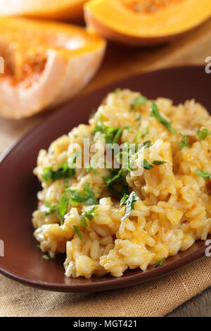Pumpkin risotto on a rustic table Stock Photo - Alamy