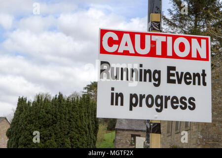 Sign running event in progress for 10k run route Stock Photo - Alamy