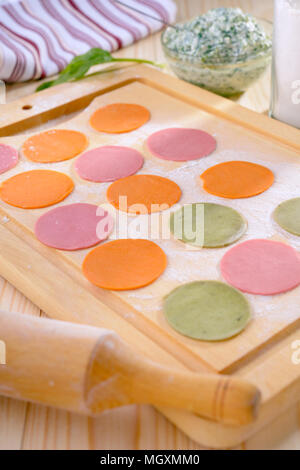 Cooking multi-colored ravioli with spinach and ricotta Stock Photo - Alamy
