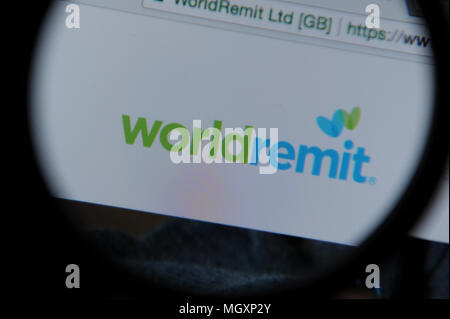WorldRemit logo seen through a magnifying glass. WorldRemit is an ...