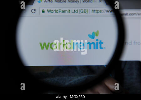 WorldRemit logo seen through a magnifying glass. WorldRemit is an ...