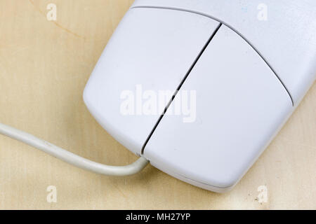 Old computer mouse running on the principle of a ball on a wooden table ...