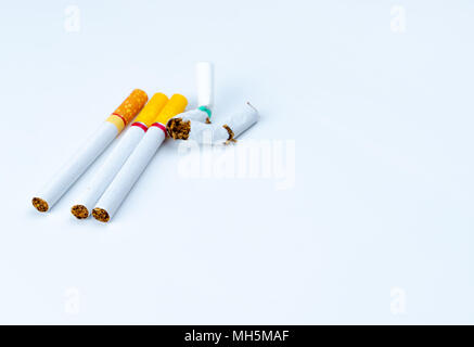 broken pile cigarette or tobacco on white background Stock Photo - Alamy