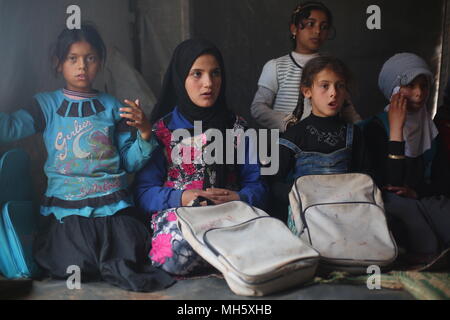 Idlib, Syria. 30th Apr, 2018. Syrian girls stand in a circle at a ...