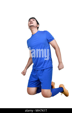 Excited asian male footballer posing celebrate isolated over white ...