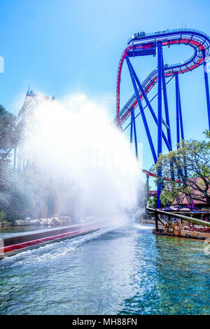 Ride roller coaster in motion in amusement park Stock Photo - Alamy