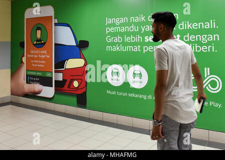 Grab advertisement inside Kuala Lumpur Subway system Stock Photo - Alamy