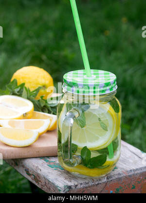 Homemade Lemon Juice on an wooden table (selective focus) as detailed ...