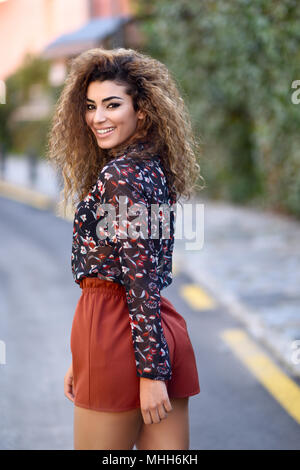Happy Young Arabic Woman With Black Curly Hairstyle Stock