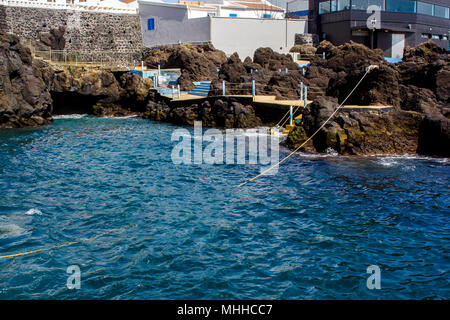 Natural pools with black volcanic rock in the Atlantic Ocean Porto ...