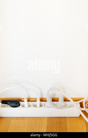 electric multiple socket outlet on a white background Stock Photo - Alamy