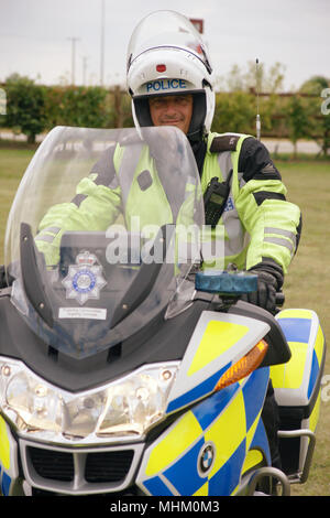 British motorcycle police officer on his BMW motorbike at the Grand ...